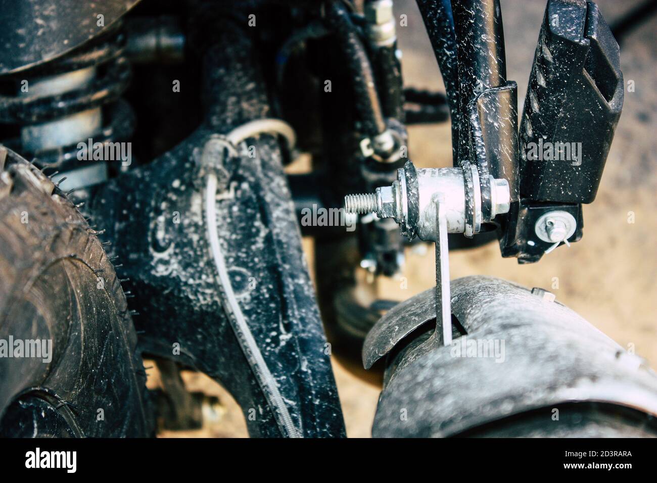 Closeup of a motorcycle rolling in the streets of the city center of ...