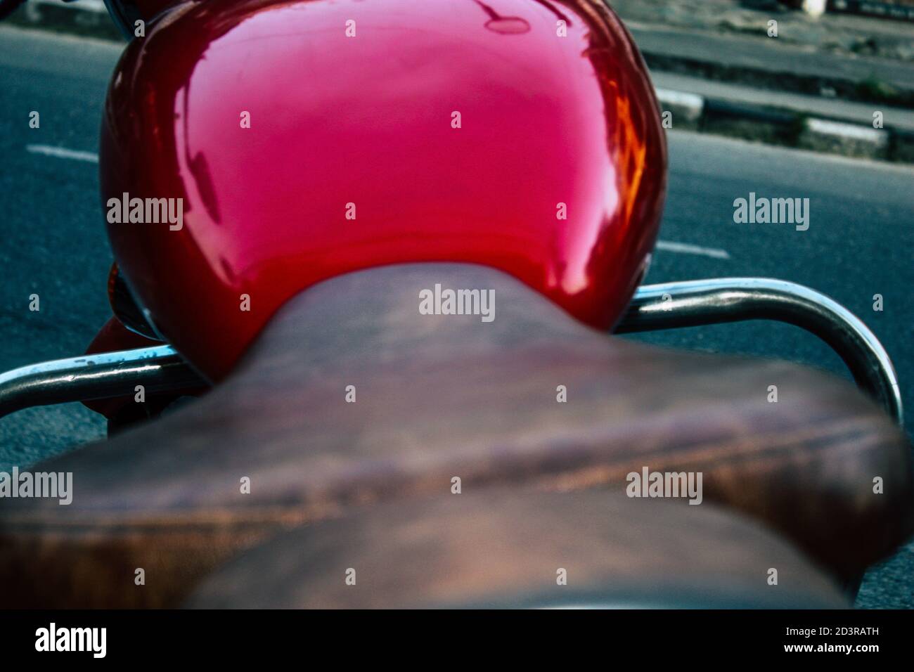 Closeup of a motorcycle rolling in the streets of the city center of ...