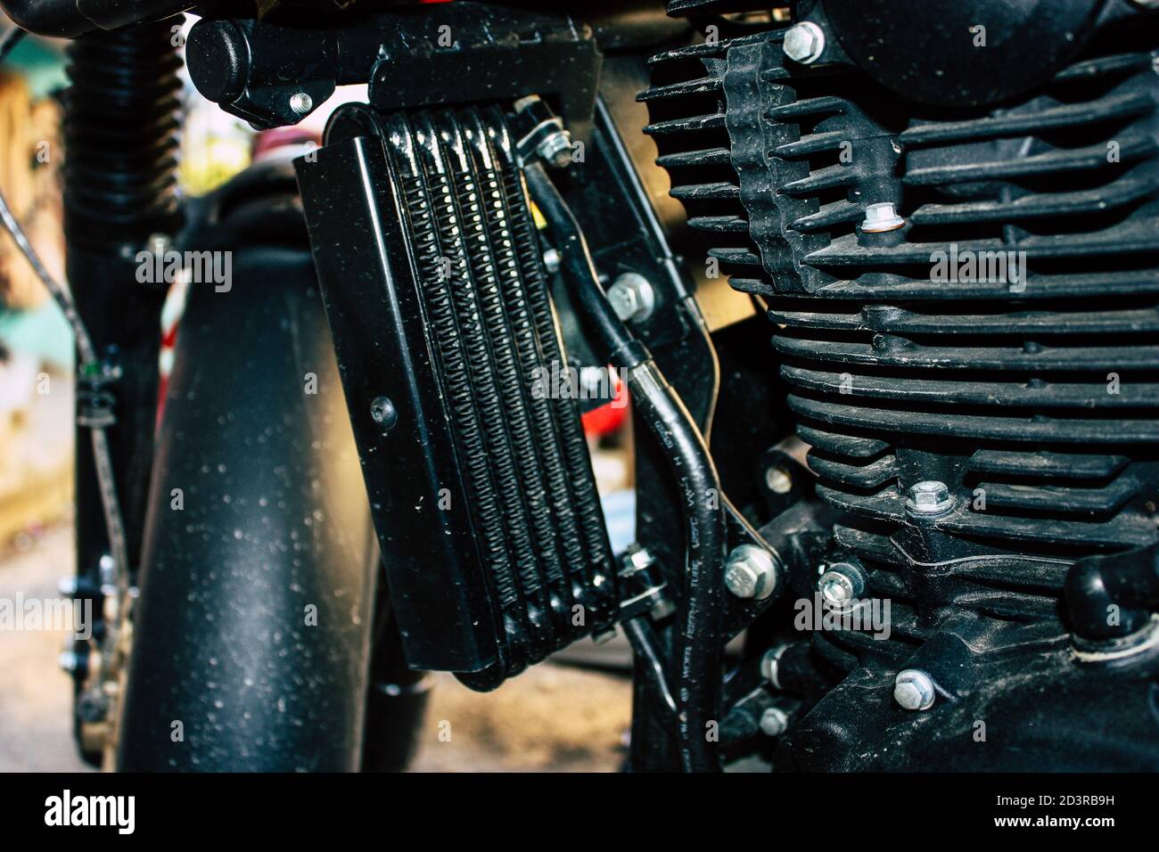 Closeup of a motorcycle rolling in the streets of the city center of ...