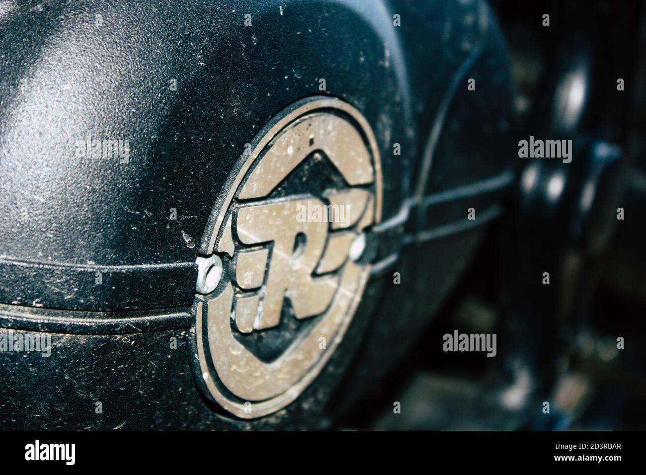Closeup of a motorcycle rolling in the streets of the city center of ...