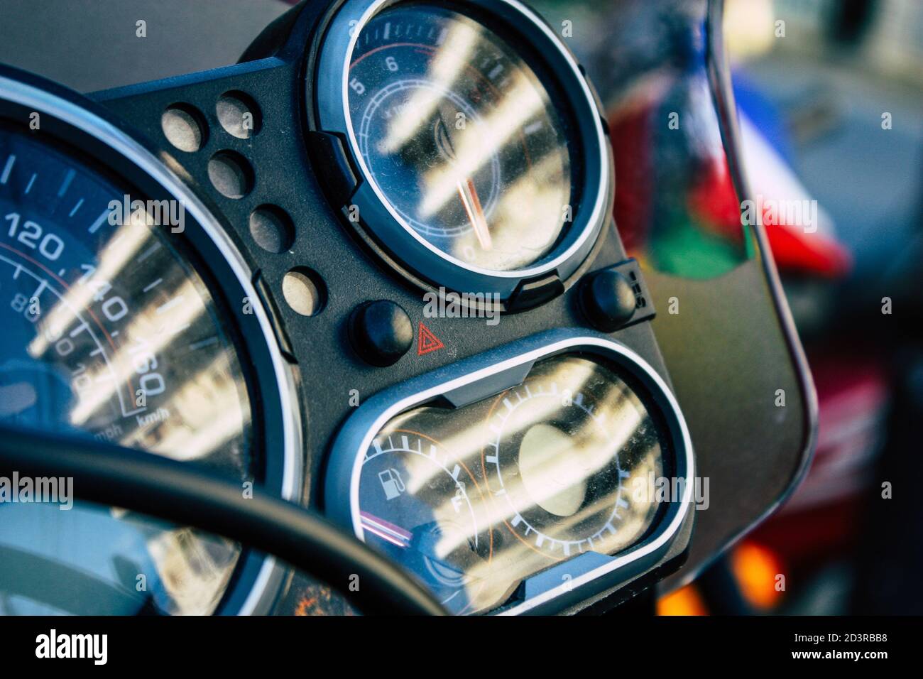 Closeup of a motorcycle rolling in the streets of the city center of ...