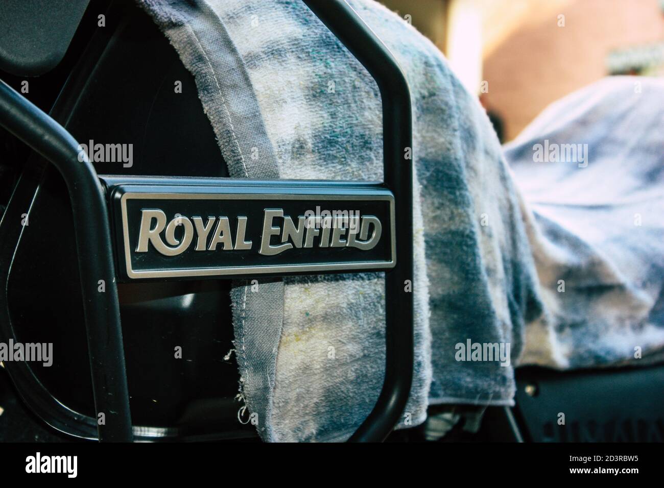 Closeup of a motorcycle rolling in the streets of the city center of ...