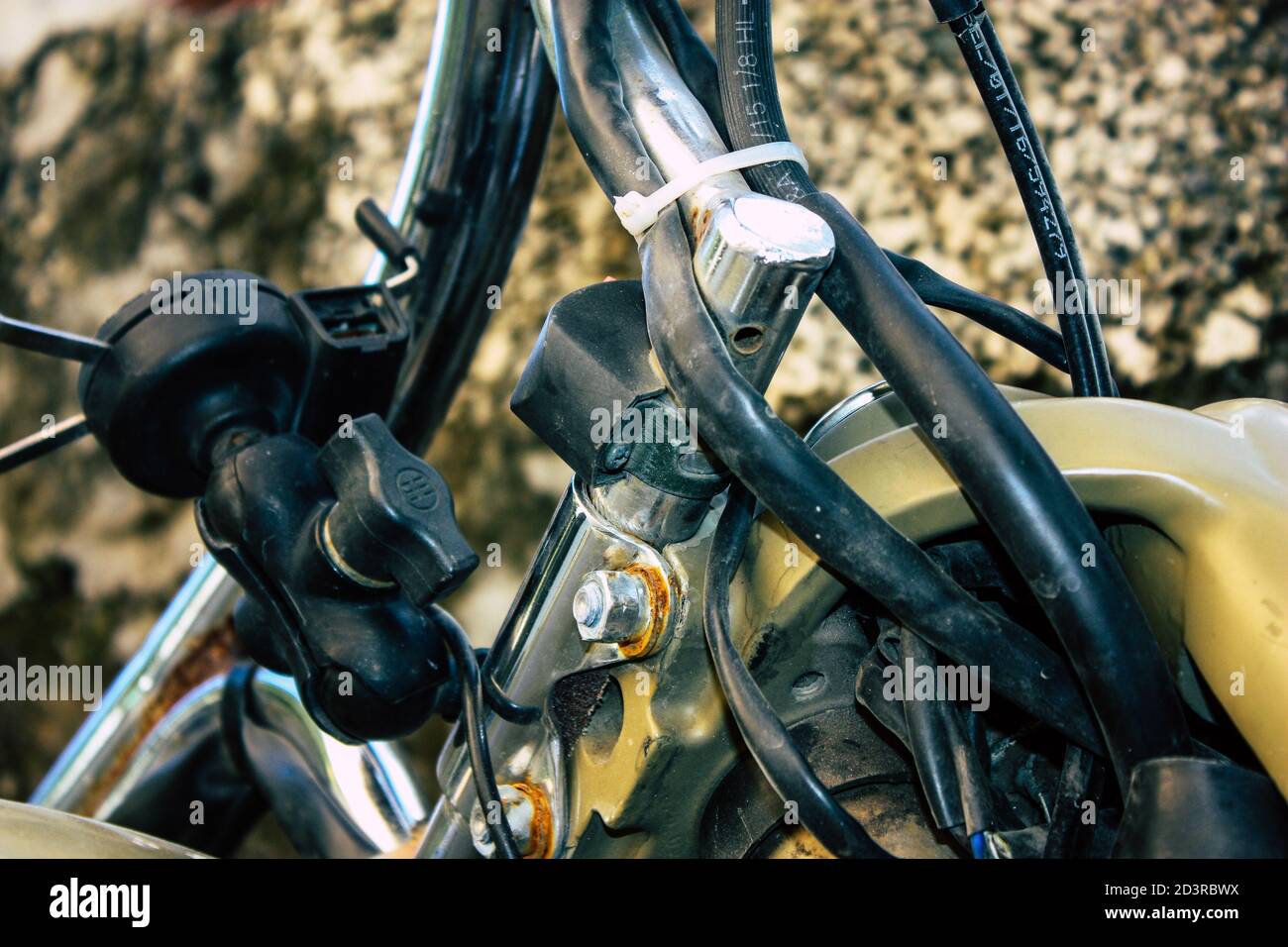 Closeup of a motorcycle rolling in the streets of the city center of ...
