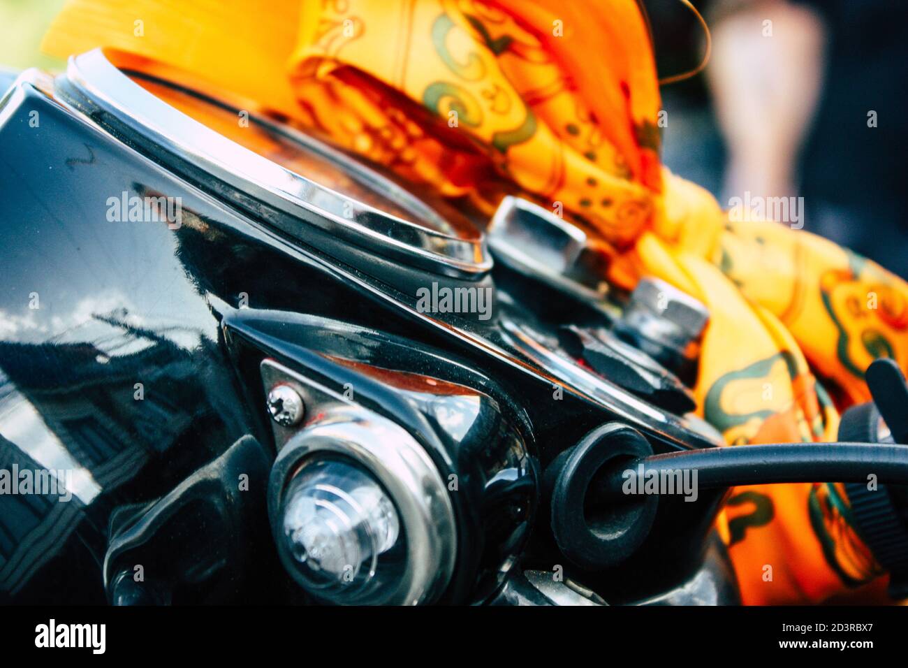 Closeup of a motorcycle rolling in the streets of the city center of ...