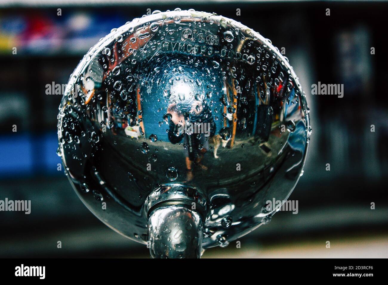 Closeup of a motorcycle rolling in the streets of the city center of ...