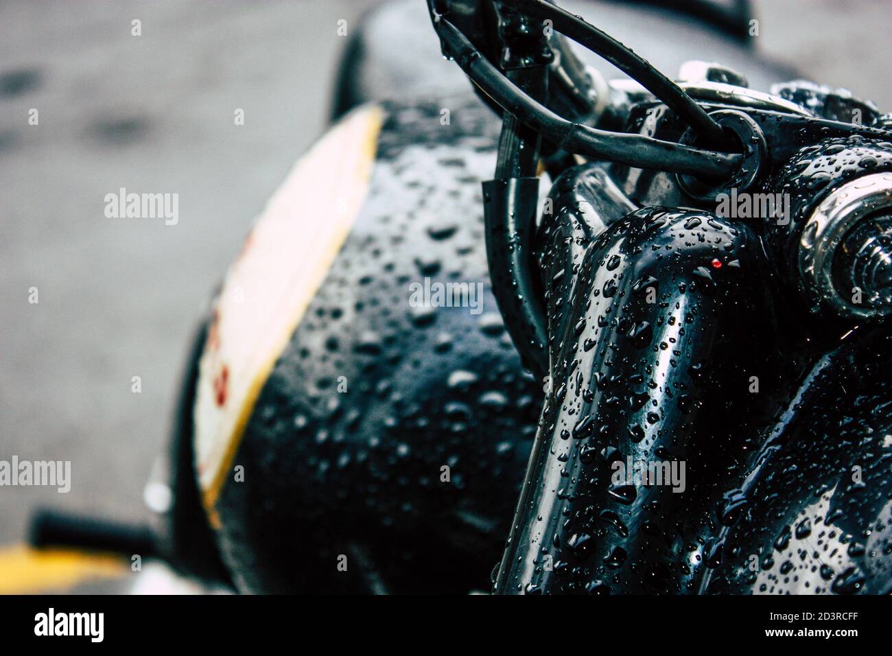 Closeup of a motorcycle rolling in the streets of the city center of ...