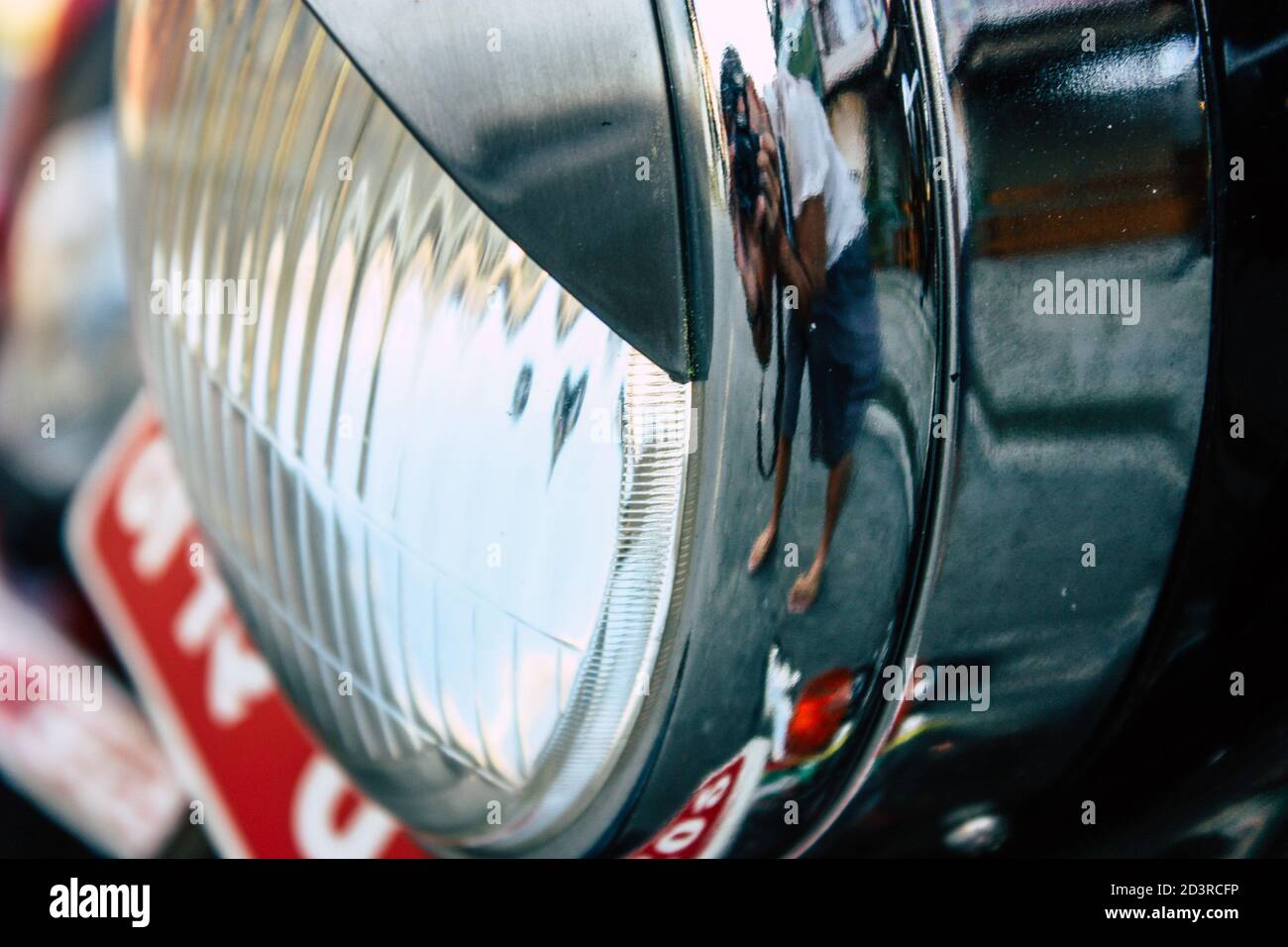 Closeup of a motorcycle rolling in the streets of the city center of ...