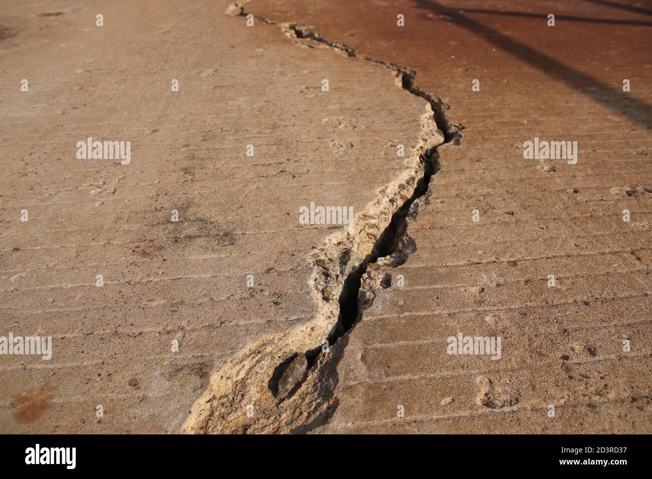 A large crack in concrete. Earthquake concept photo Stock Photo - Alamy