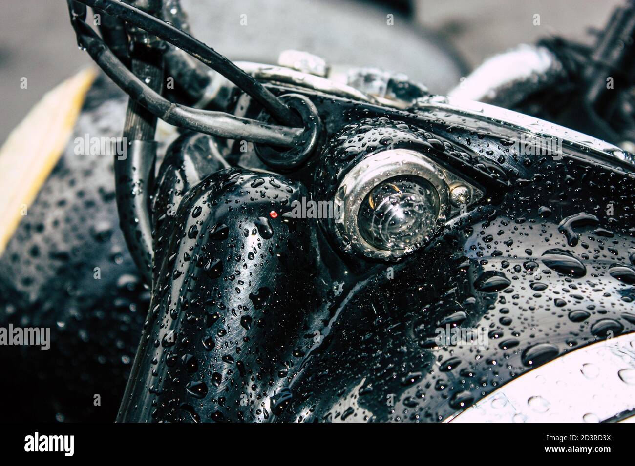 Closeup of a motorcycle rolling in the streets of the city center of ...
