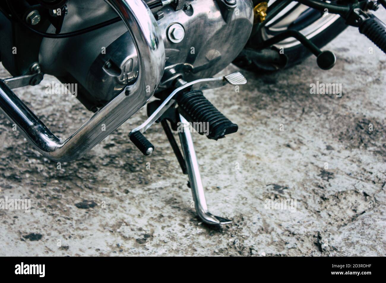 Closeup of a motorcycle rolling in the streets of the city center of ...