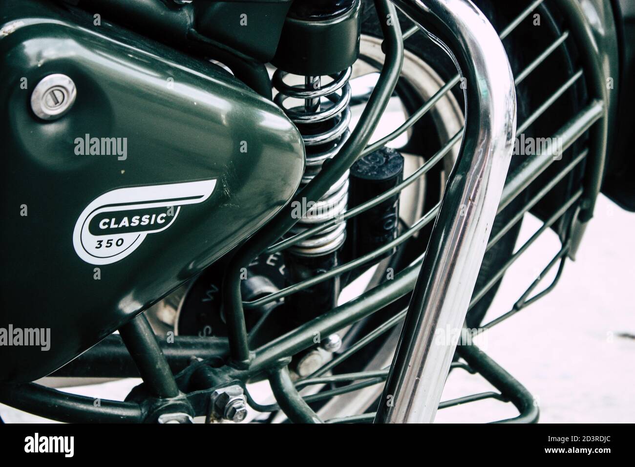 Closeup of a motorcycle rolling in the streets of the city center of ...