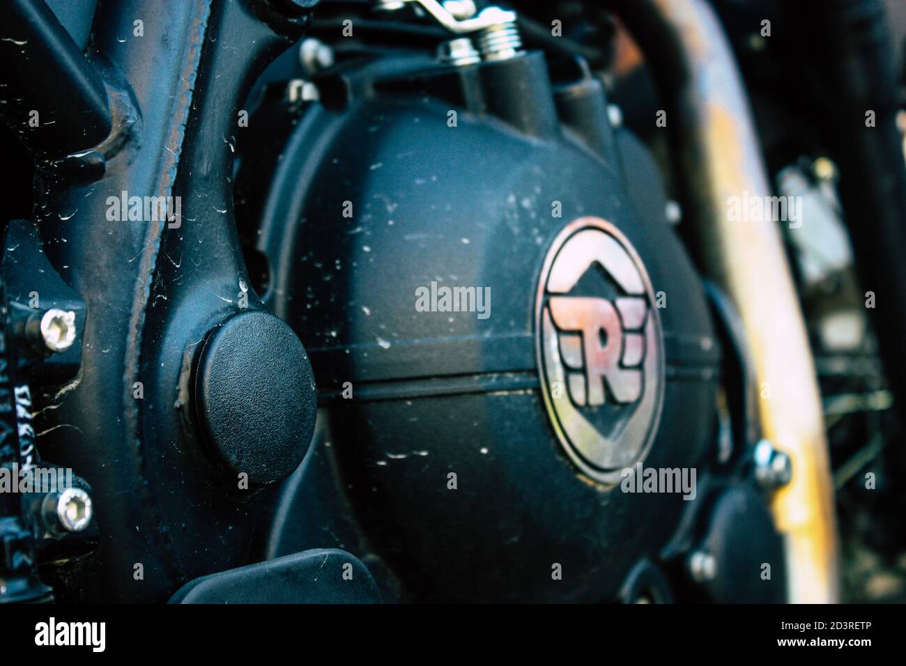 Closeup of a motorcycle rolling in the streets of the city center of ...