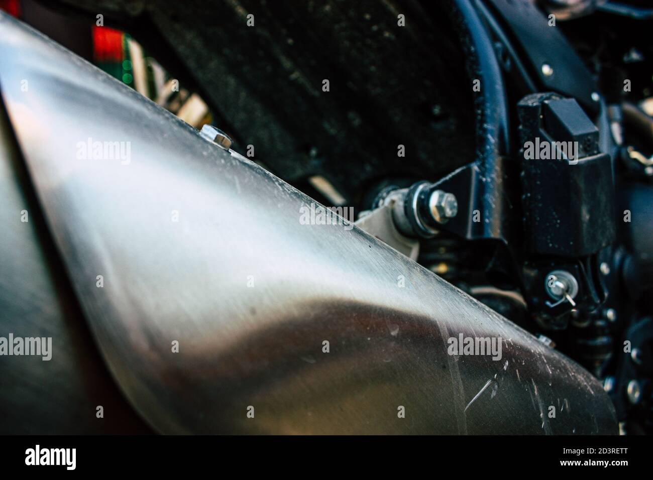 Closeup of a motorcycle rolling in the streets of the city center of ...