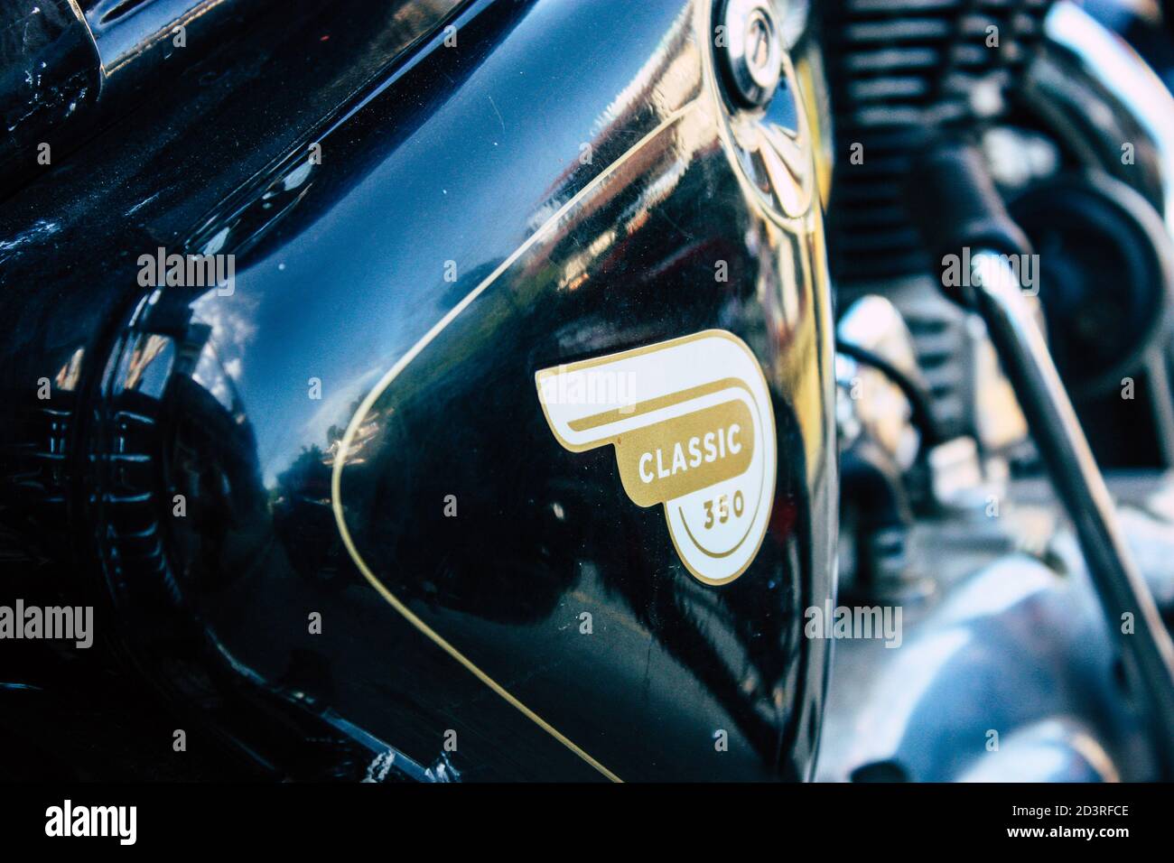 Closeup of a motorcycle rolling in the streets of the city center of ...