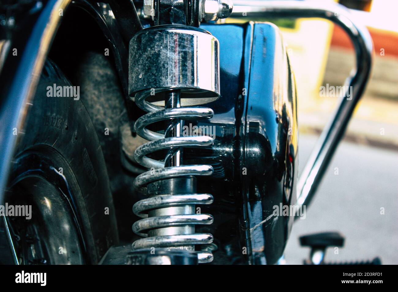 Closeup of a motorcycle rolling in the streets of the city center of ...