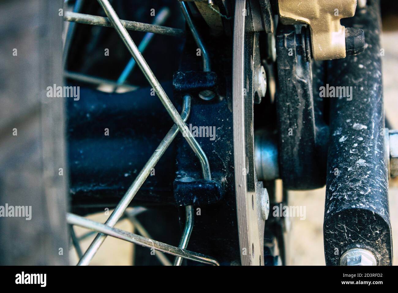 Closeup of a motorcycle rolling in the streets of the city center of ...
