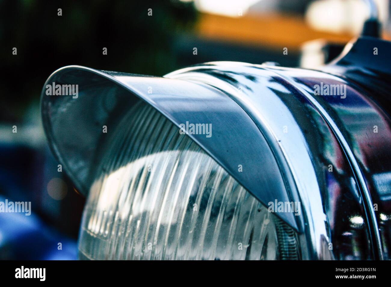 Closeup of a motorcycle rolling in the streets of the city center of ...