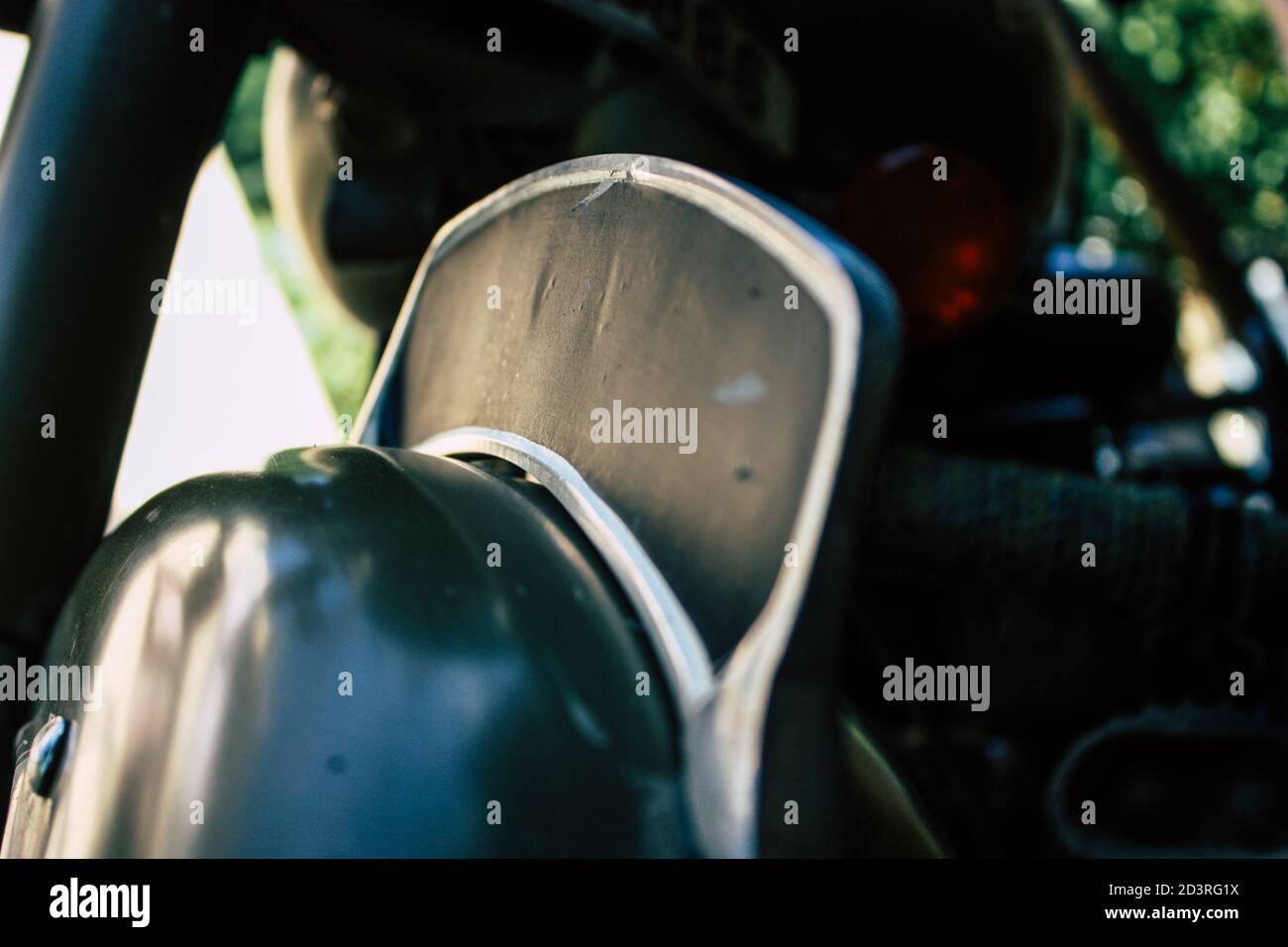 Closeup of a motorcycle rolling in the streets of the city center of ...