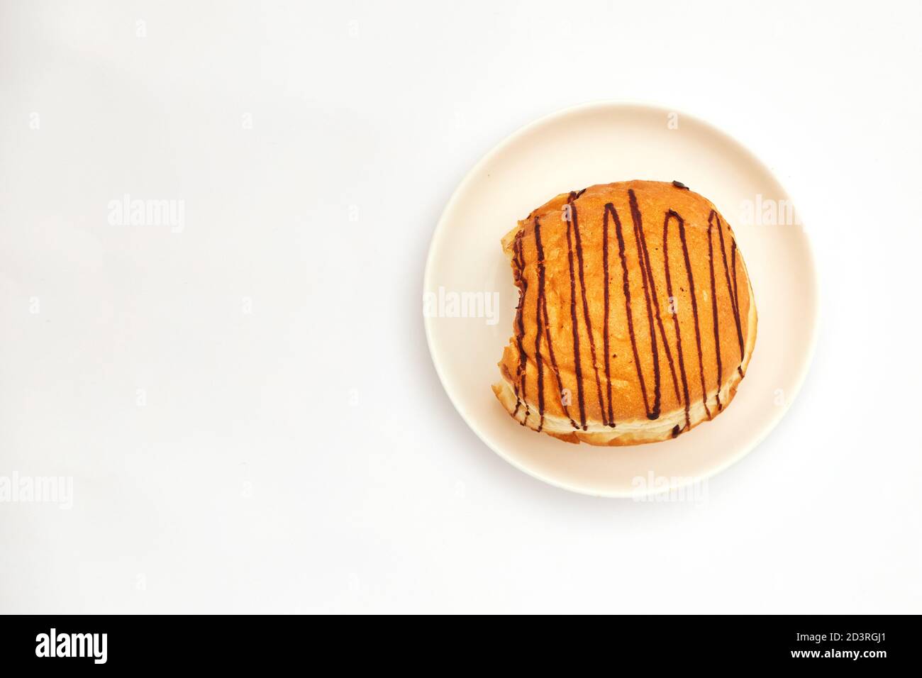 chocolate bitten donut on white background isolate, copy space, top ...