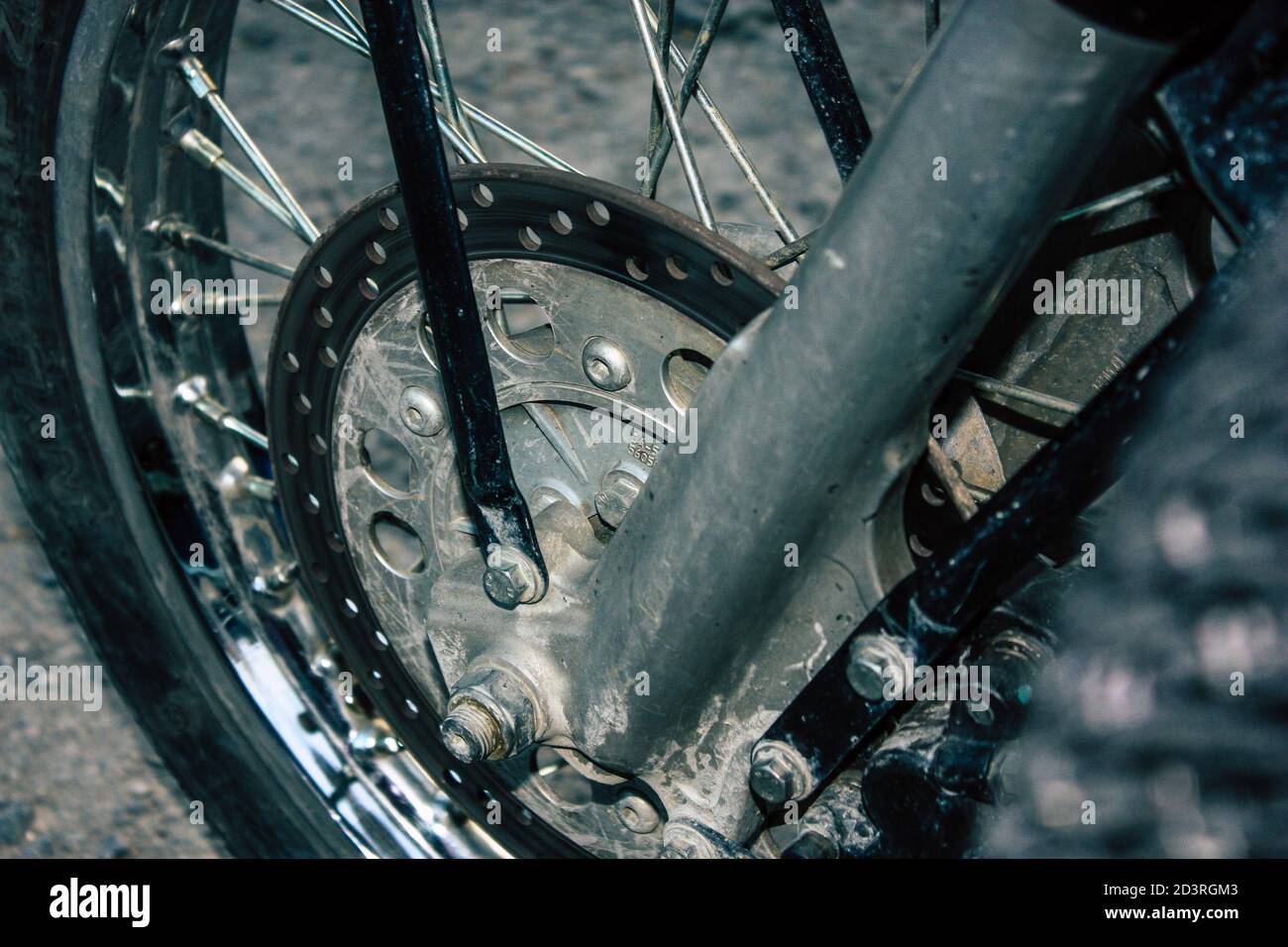 Closeup of a motorcycle rolling in the streets of the city center of ...