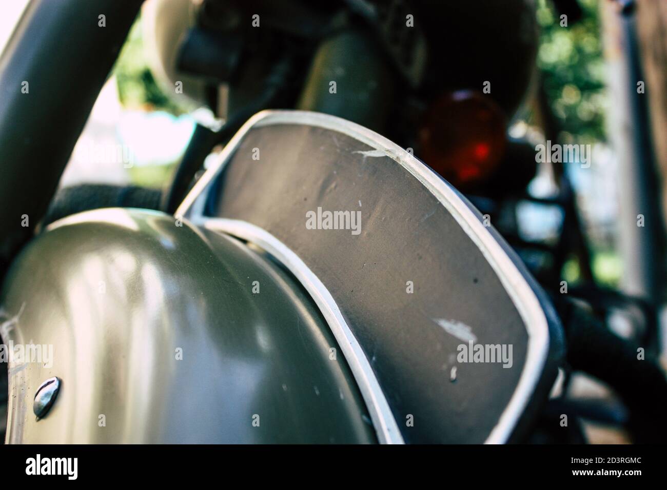 Closeup of a motorcycle rolling in the streets of the city center of ...