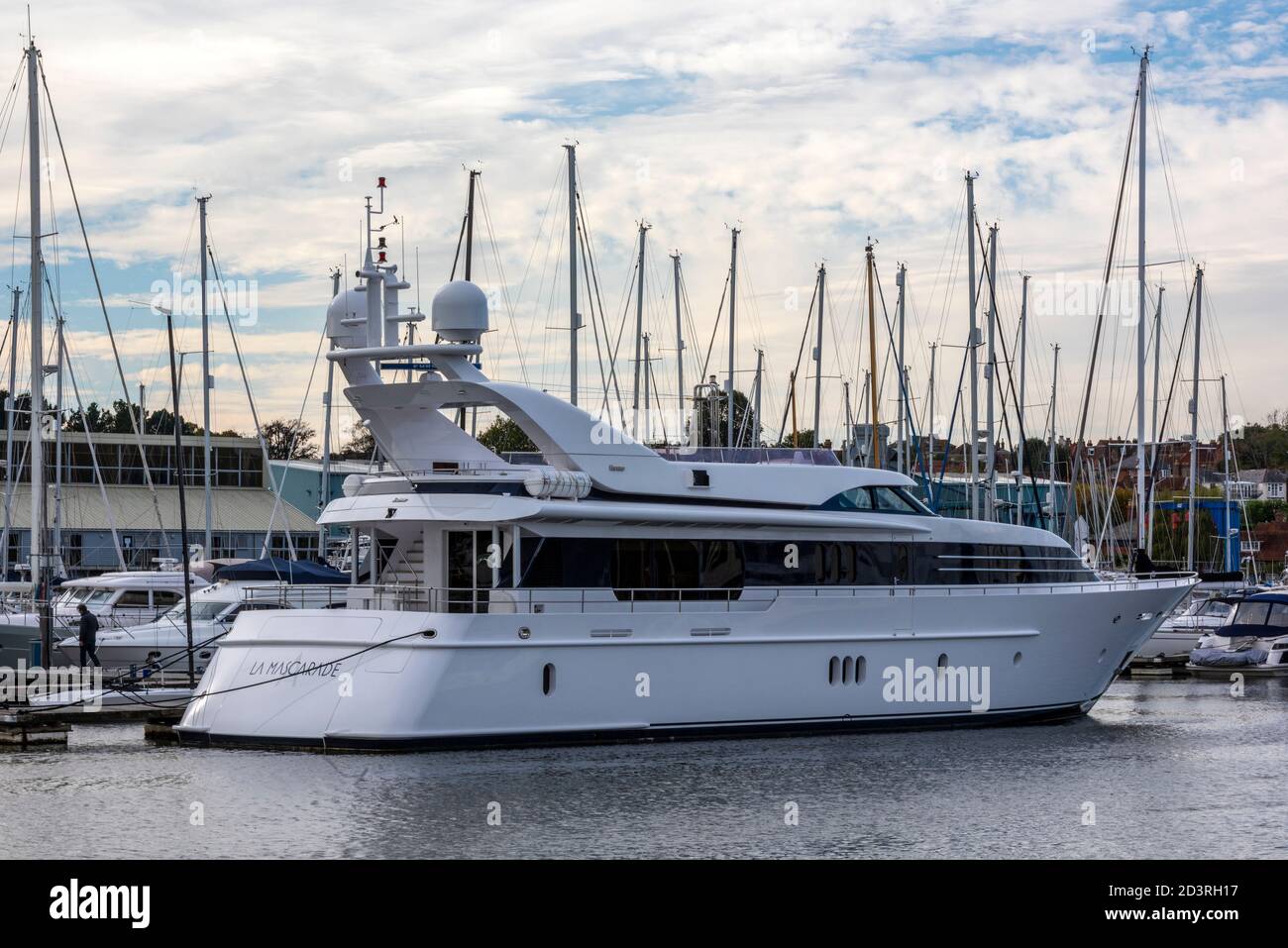 a large luxury motorboat or power boat alongside in the yacht marina in ...