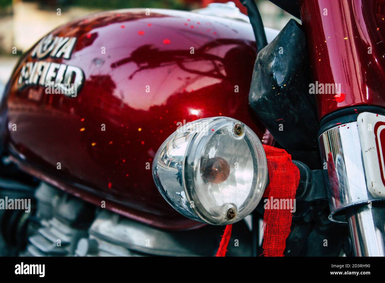 Closeup of a motorcycle rolling in the streets of the city center of ...