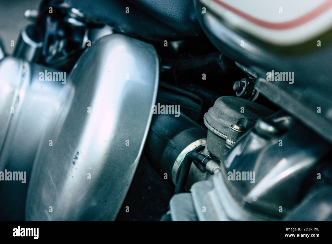 Closeup of a motorcycle rolling in the streets of the city center of ...