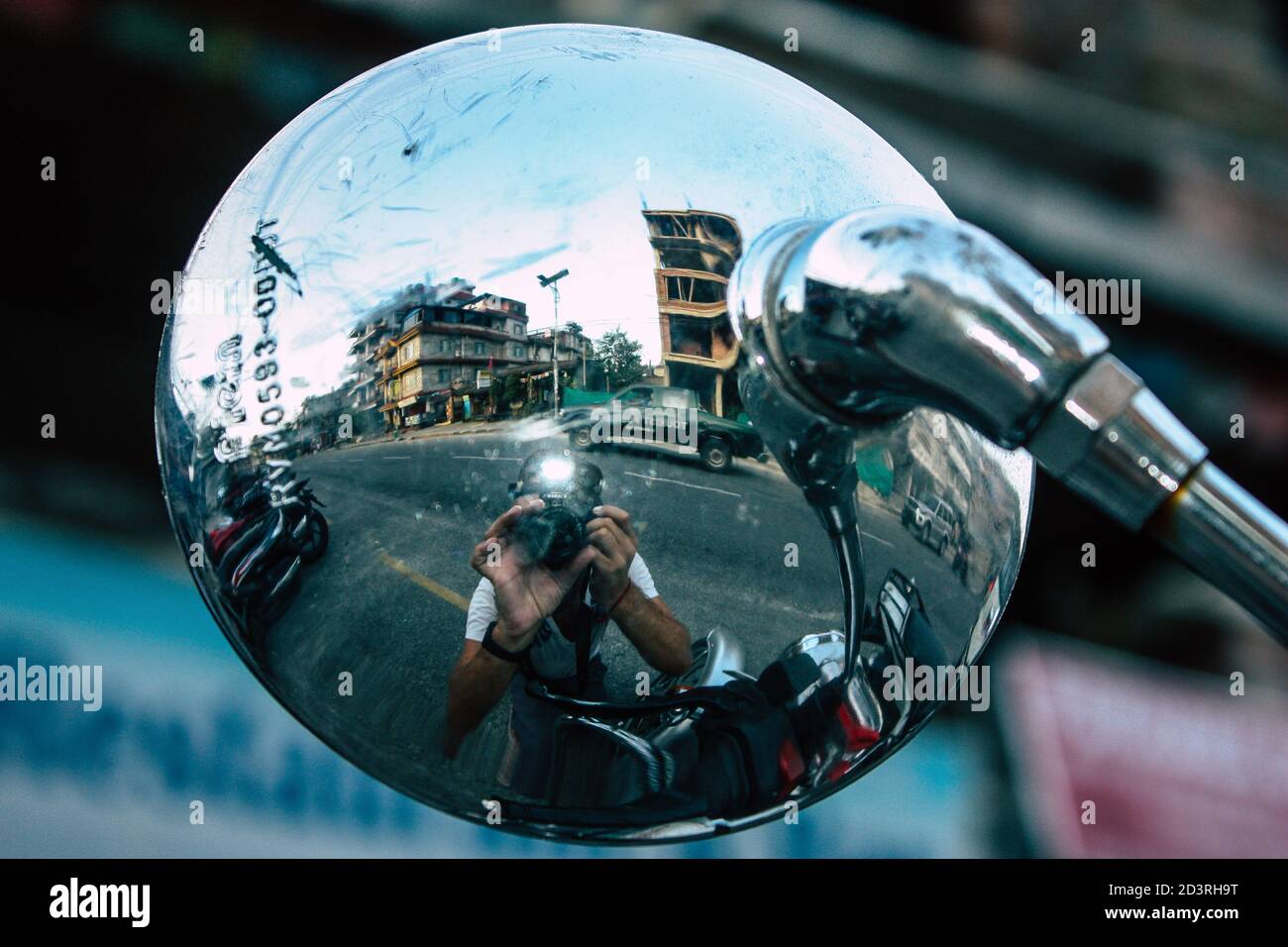 Closeup of a motorcycle rolling in the streets of the city center of ...