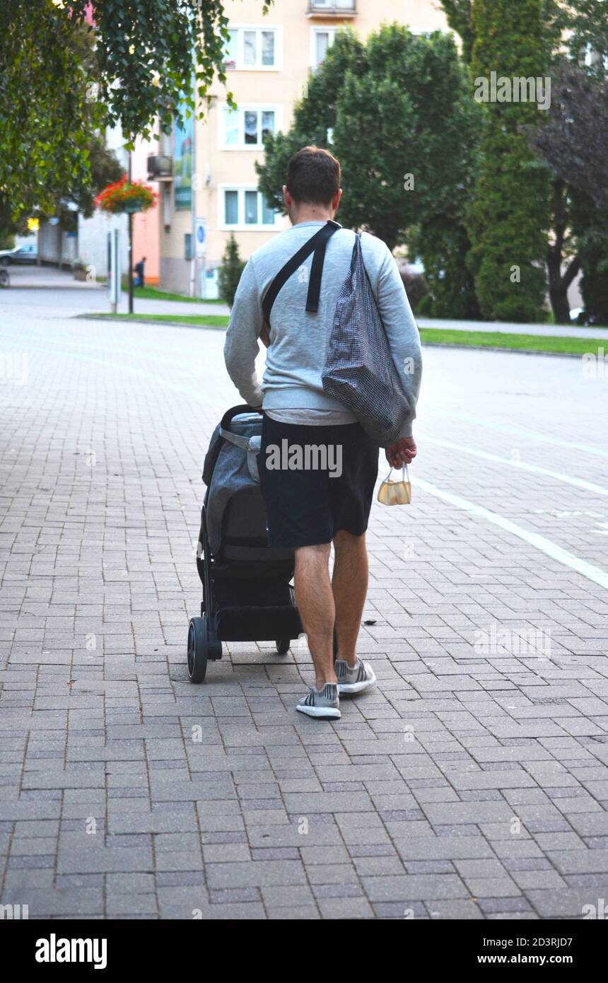 Urban white father pushing stroller hi-res stock photography and images ...