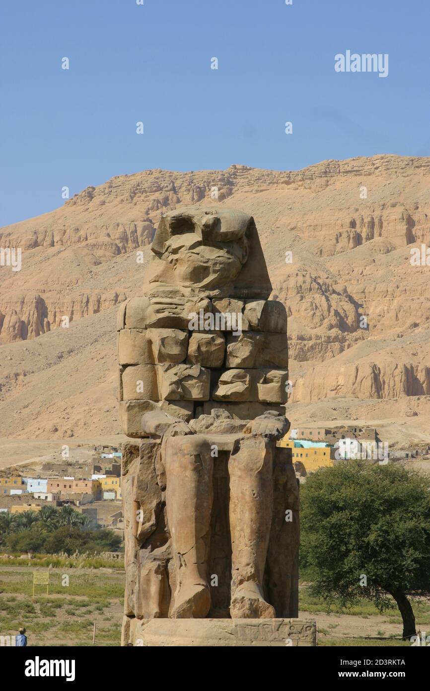 Colossi of Memnon, statues of King Amenhotep III in Nile valley, Luxor ...