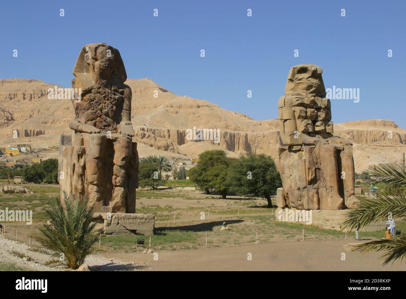 Colossi of Memnon, statues of King Amenhotep III in Nile valley, Luxor ...