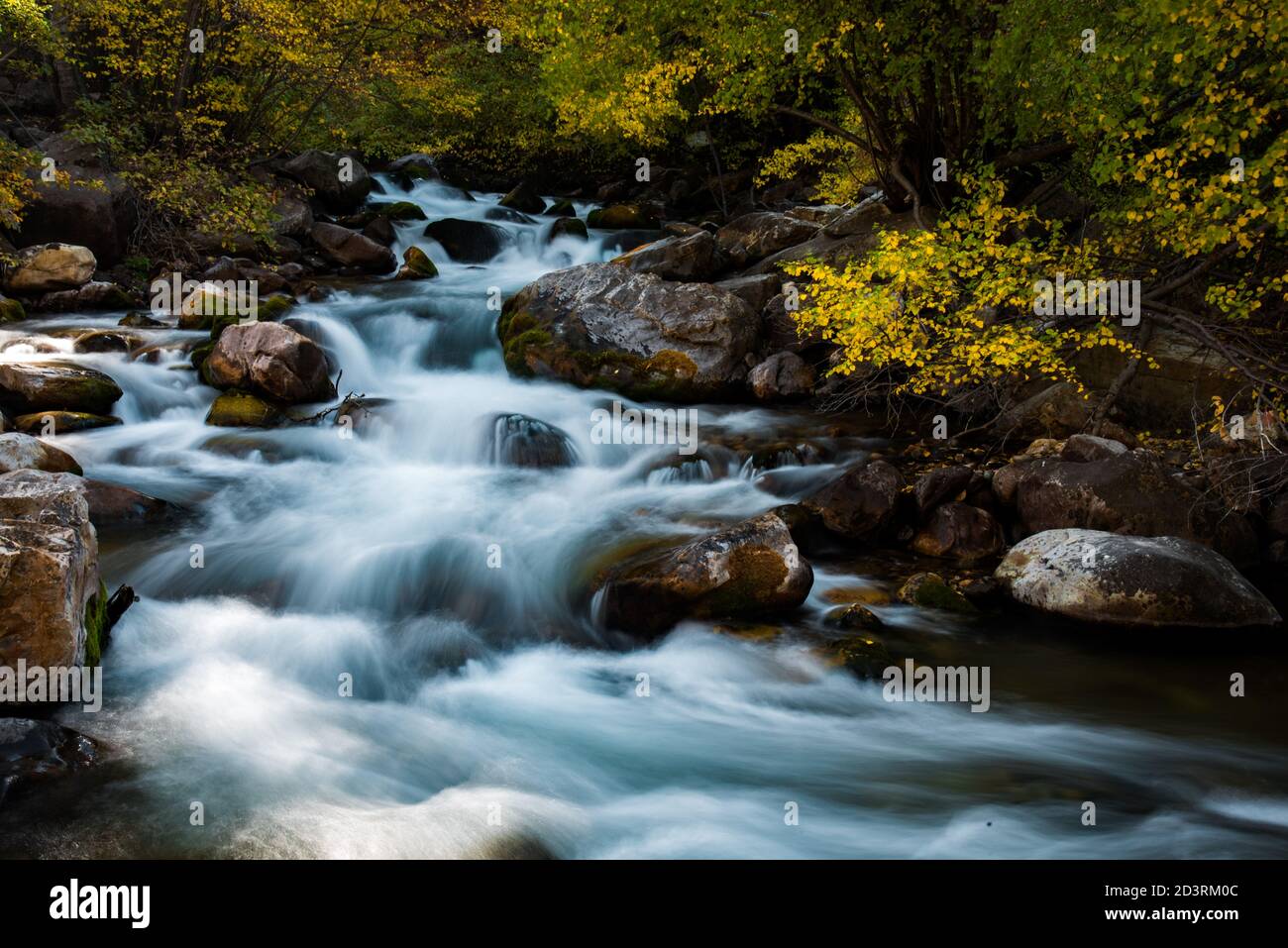 Mountain stream with Autumn colors using a slow shutter speed to ...