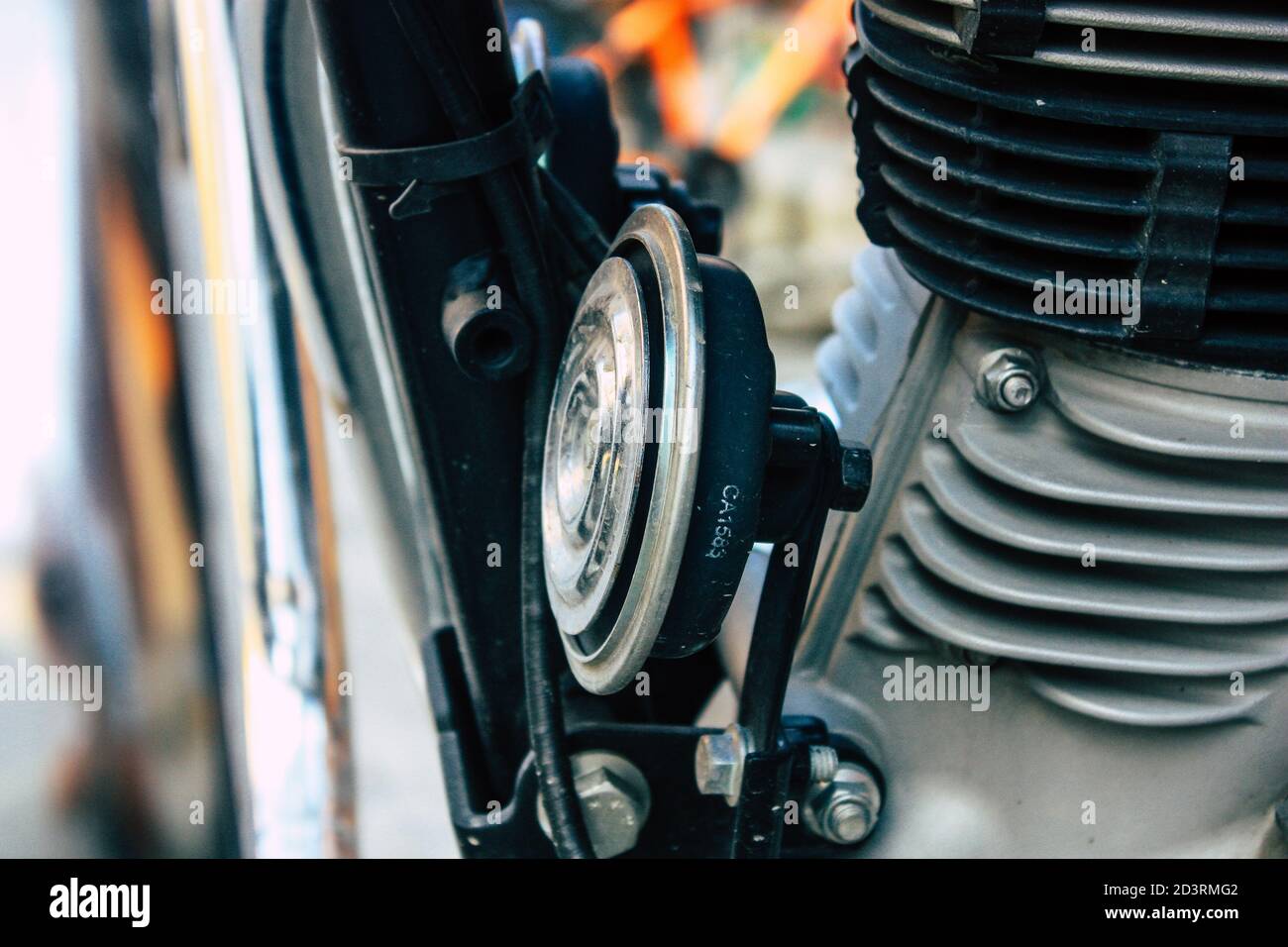 Closeup of a motorcycle rolling in the streets of the city center of ...