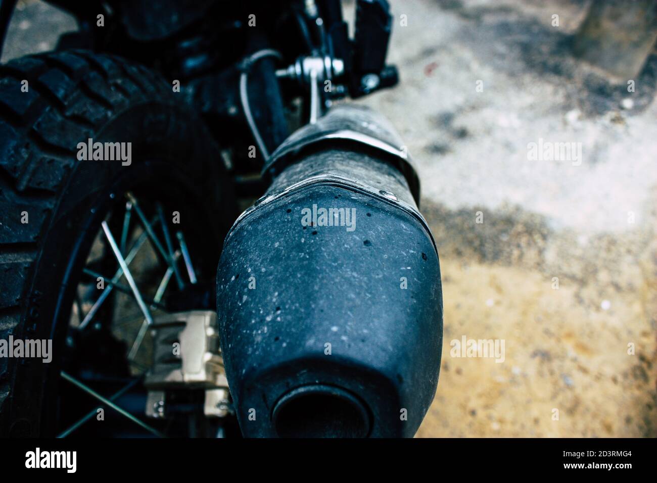 Closeup of a motorcycle rolling in the streets of the city center of ...