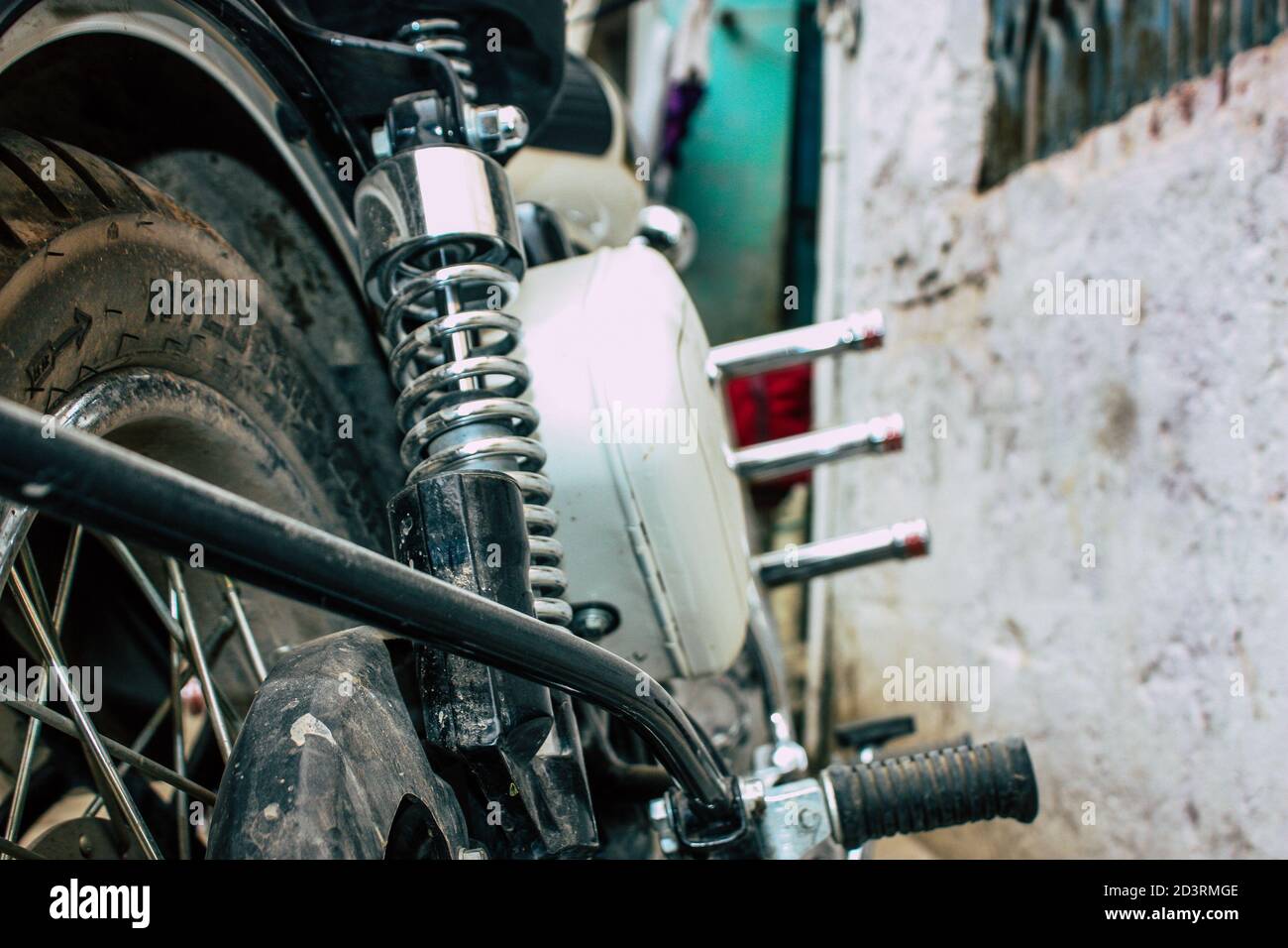 Closeup of a motorcycle rolling in the streets of the city center of ...