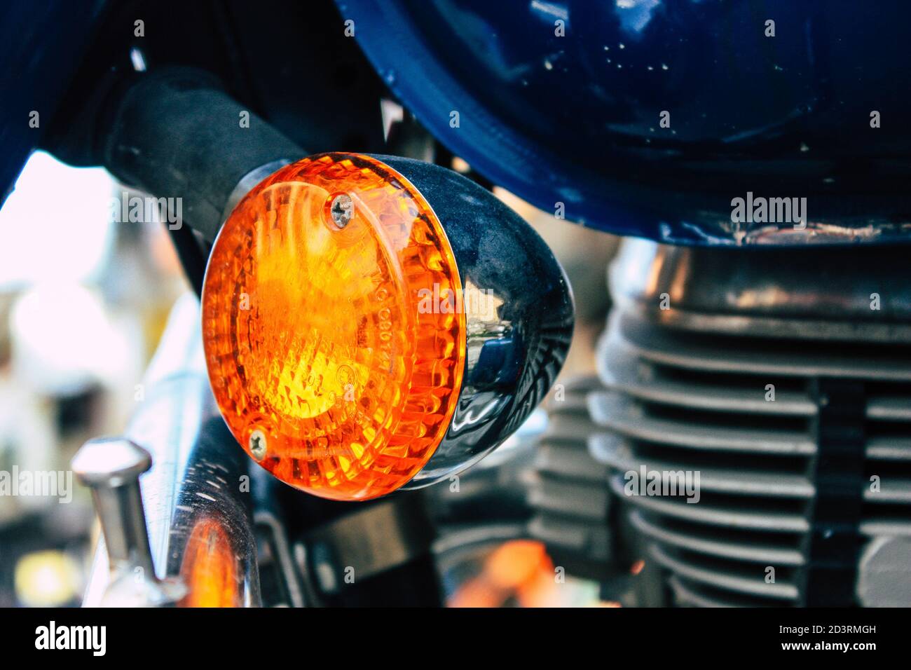 Closeup of a motorcycle rolling in the streets of the city center of ...