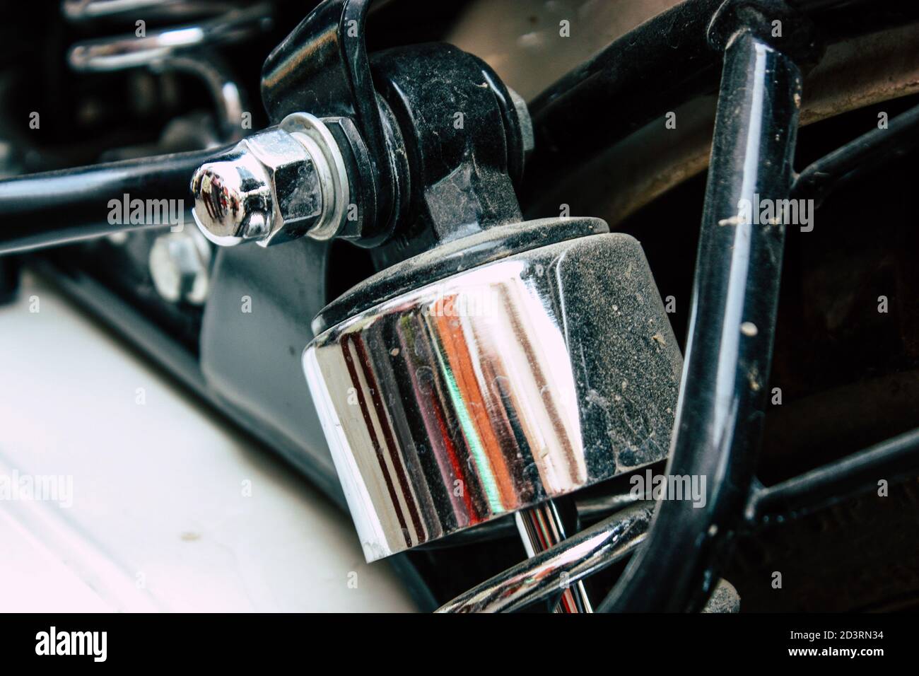 Closeup of a motorcycle rolling in the streets of the city center of ...