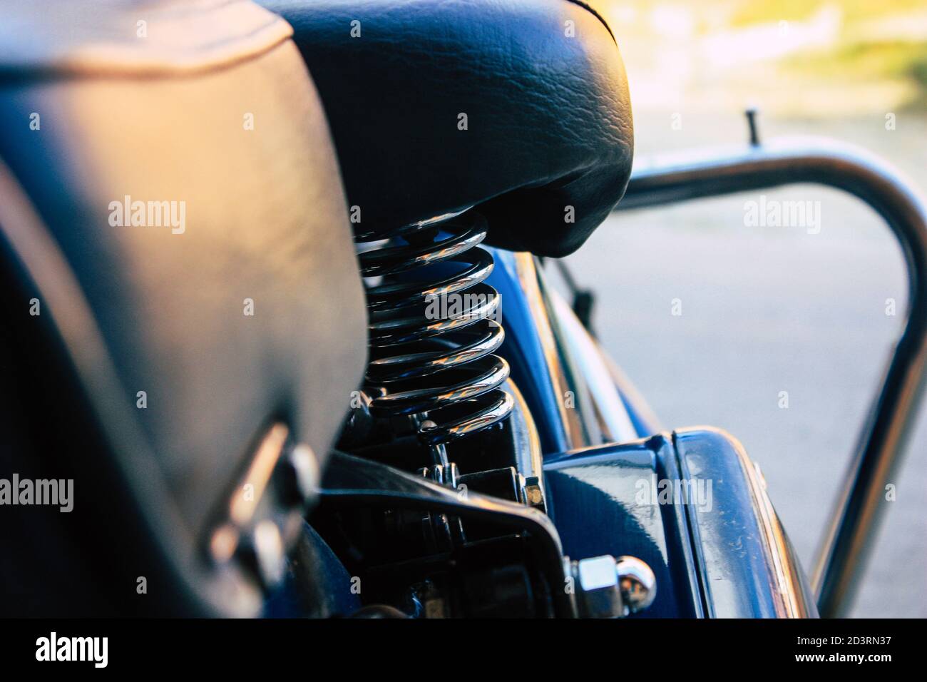 Closeup of a motorcycle rolling in the streets of the city center of ...