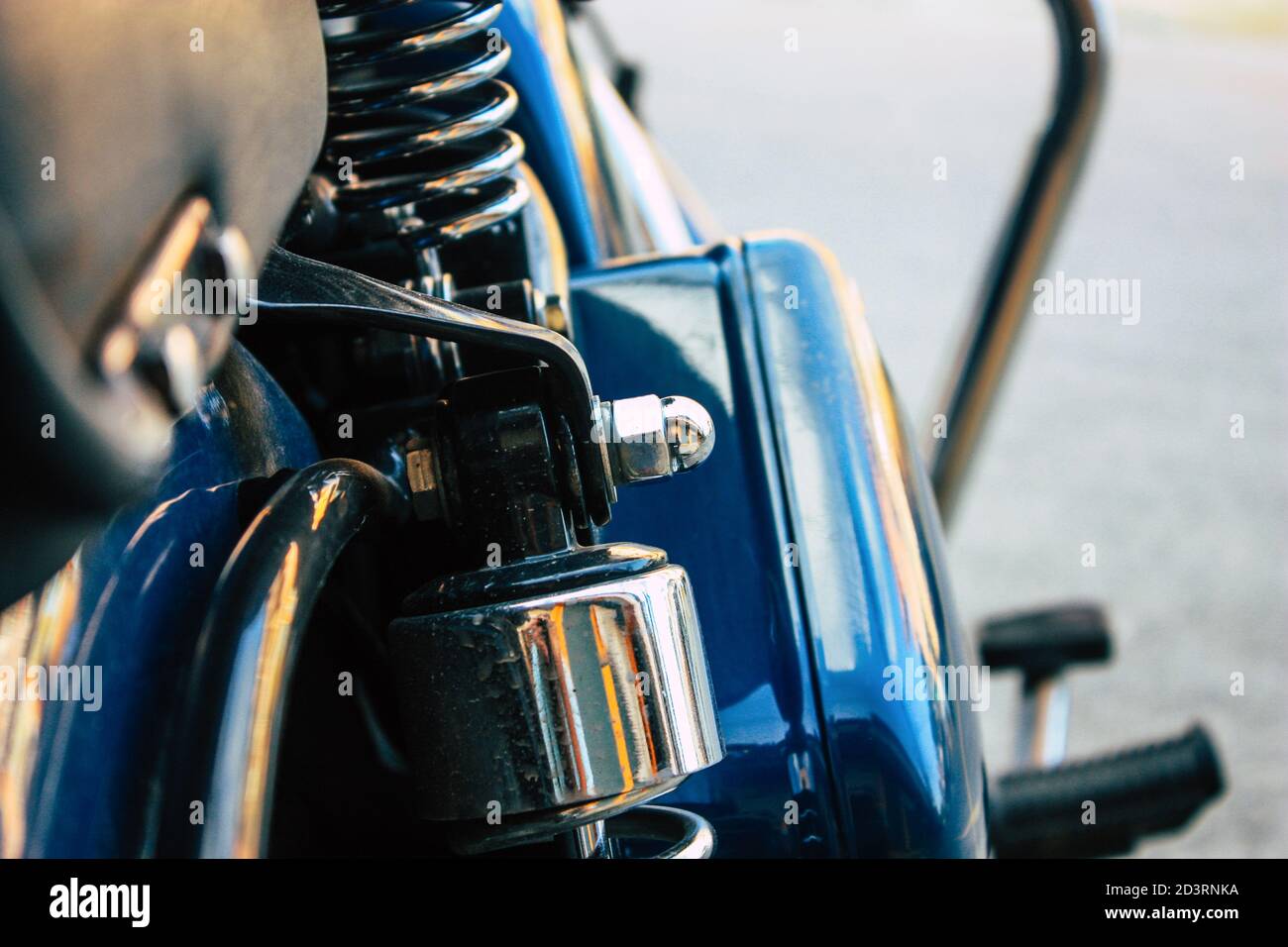 Closeup of a motorcycle rolling in the streets of the city center of ...