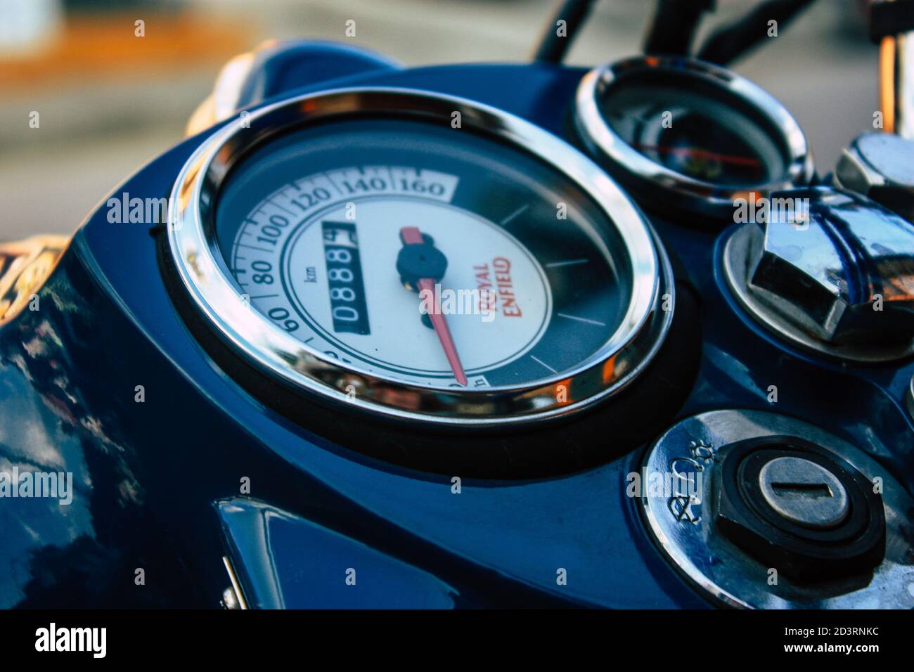 Closeup of a motorcycle rolling in the streets of the city center of ...