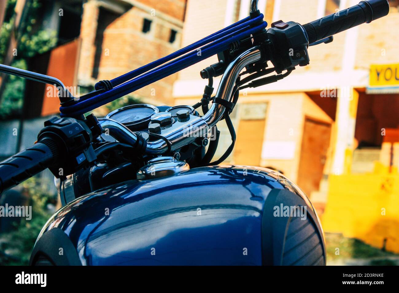 Closeup of a motorcycle rolling in the streets of the city center of ...