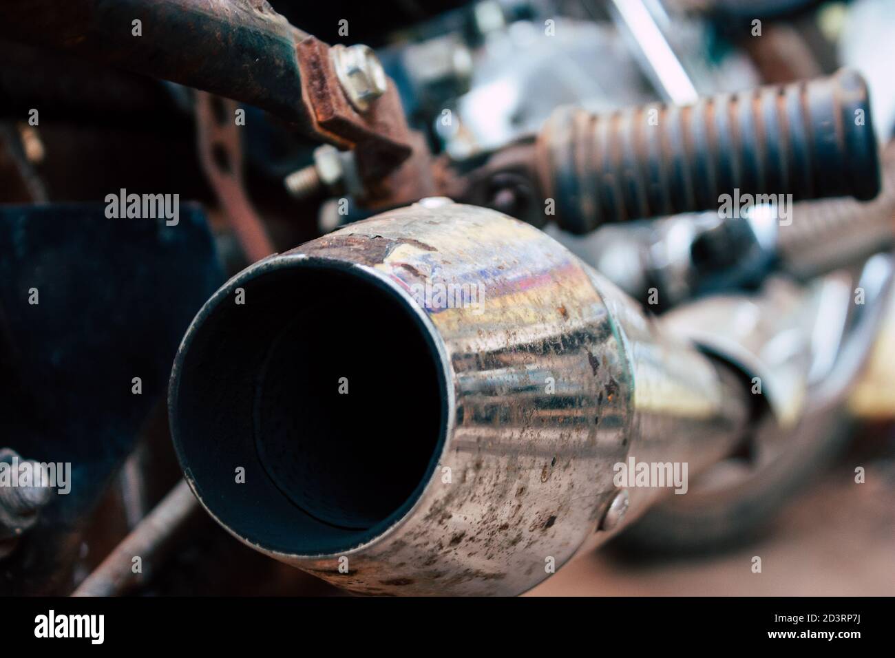 Closeup of a motorcycle rolling in the streets of the city center of ...