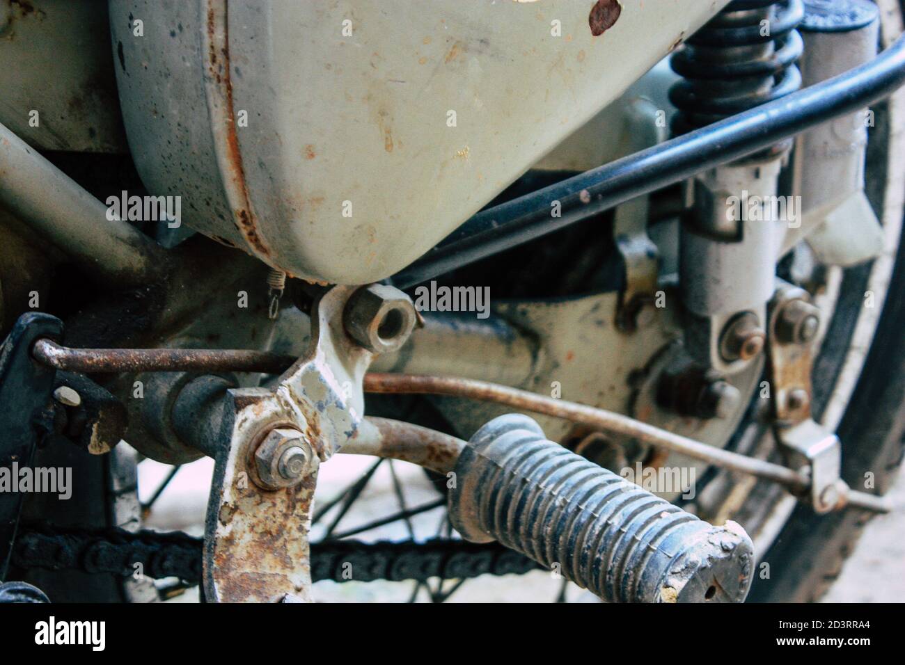 Closeup of a motorcycle rolling in the streets of the city center of ...