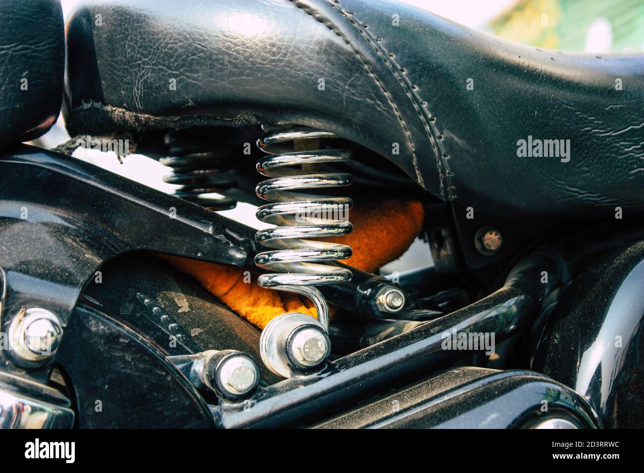 Closeup of a motorcycle rolling in the streets of the city center of ...