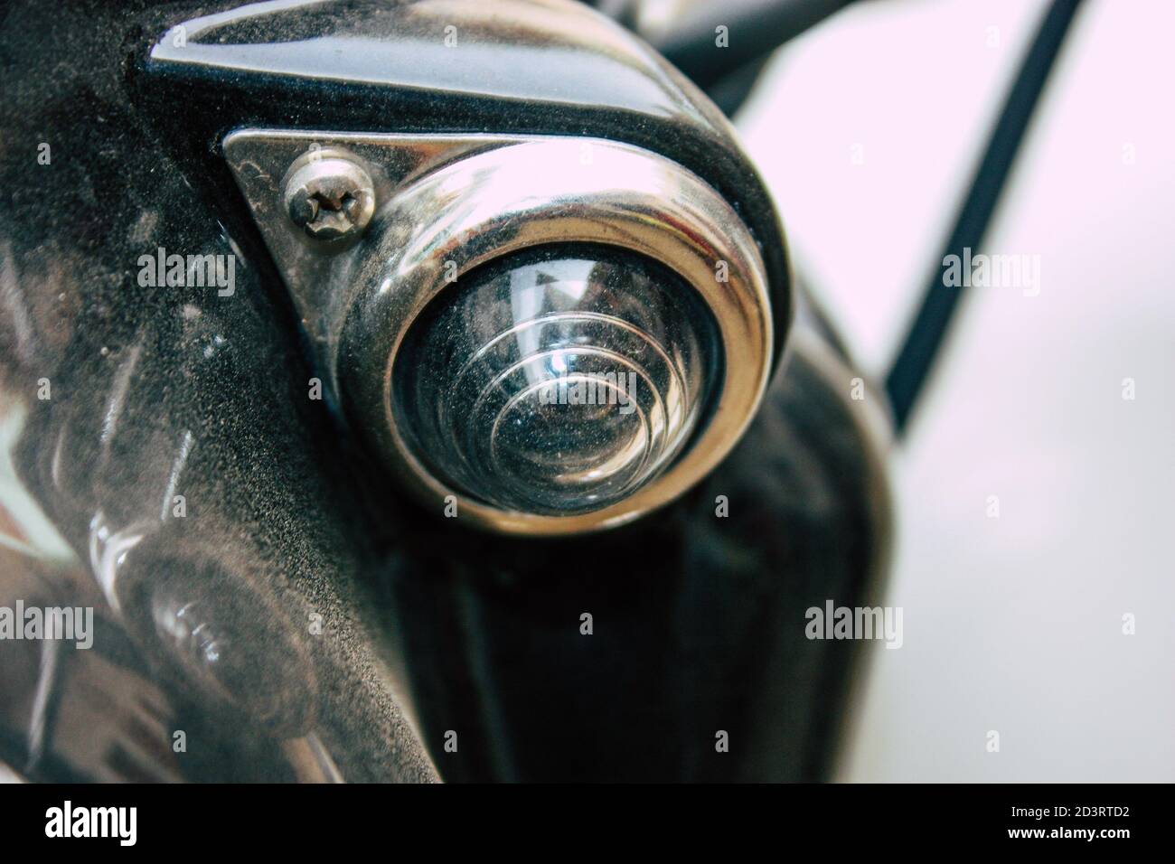 Closeup of a motorcycle rolling in the streets of the city center of ...