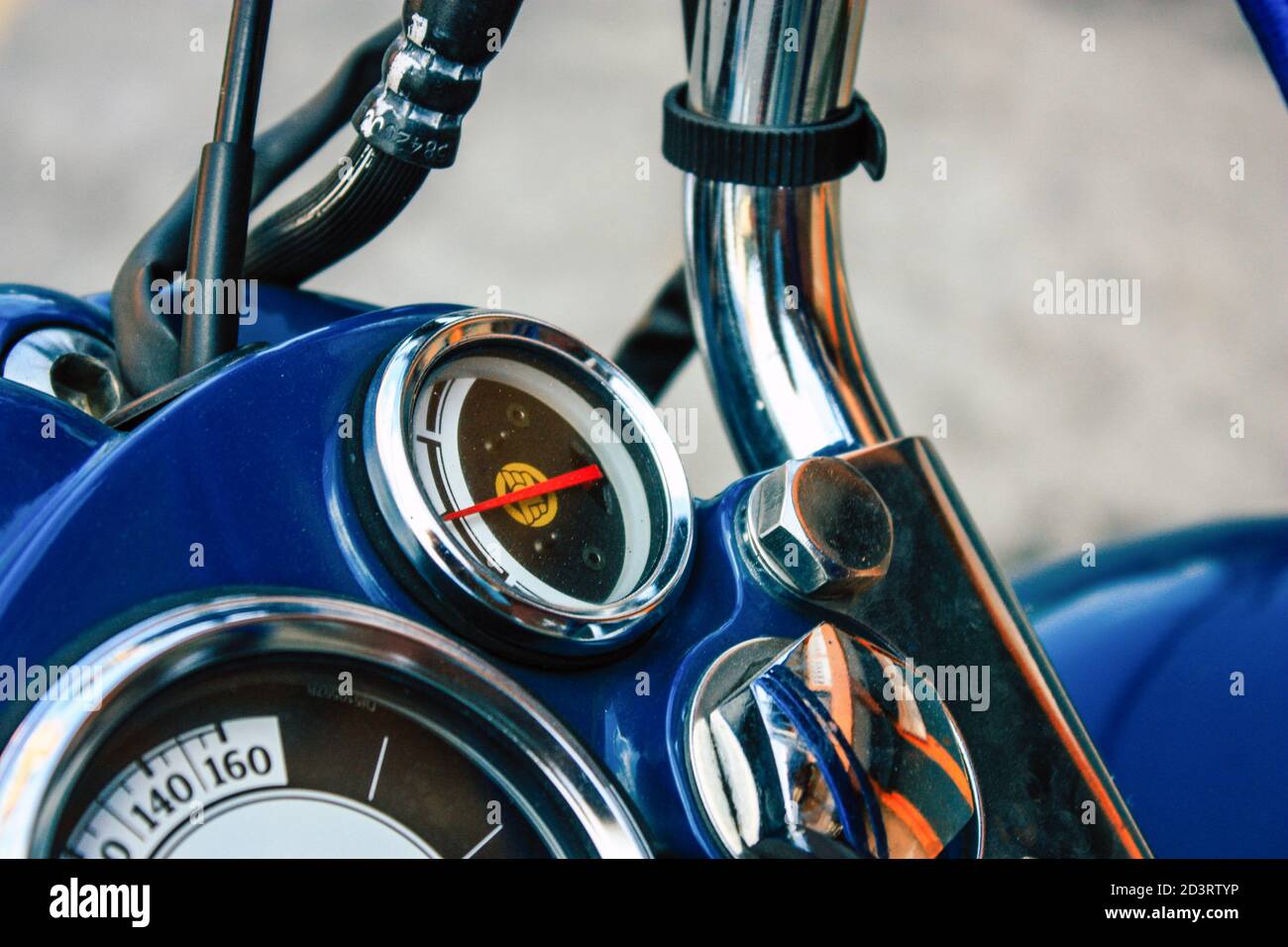 Closeup of a motorcycle rolling in the streets of the city center of ...
