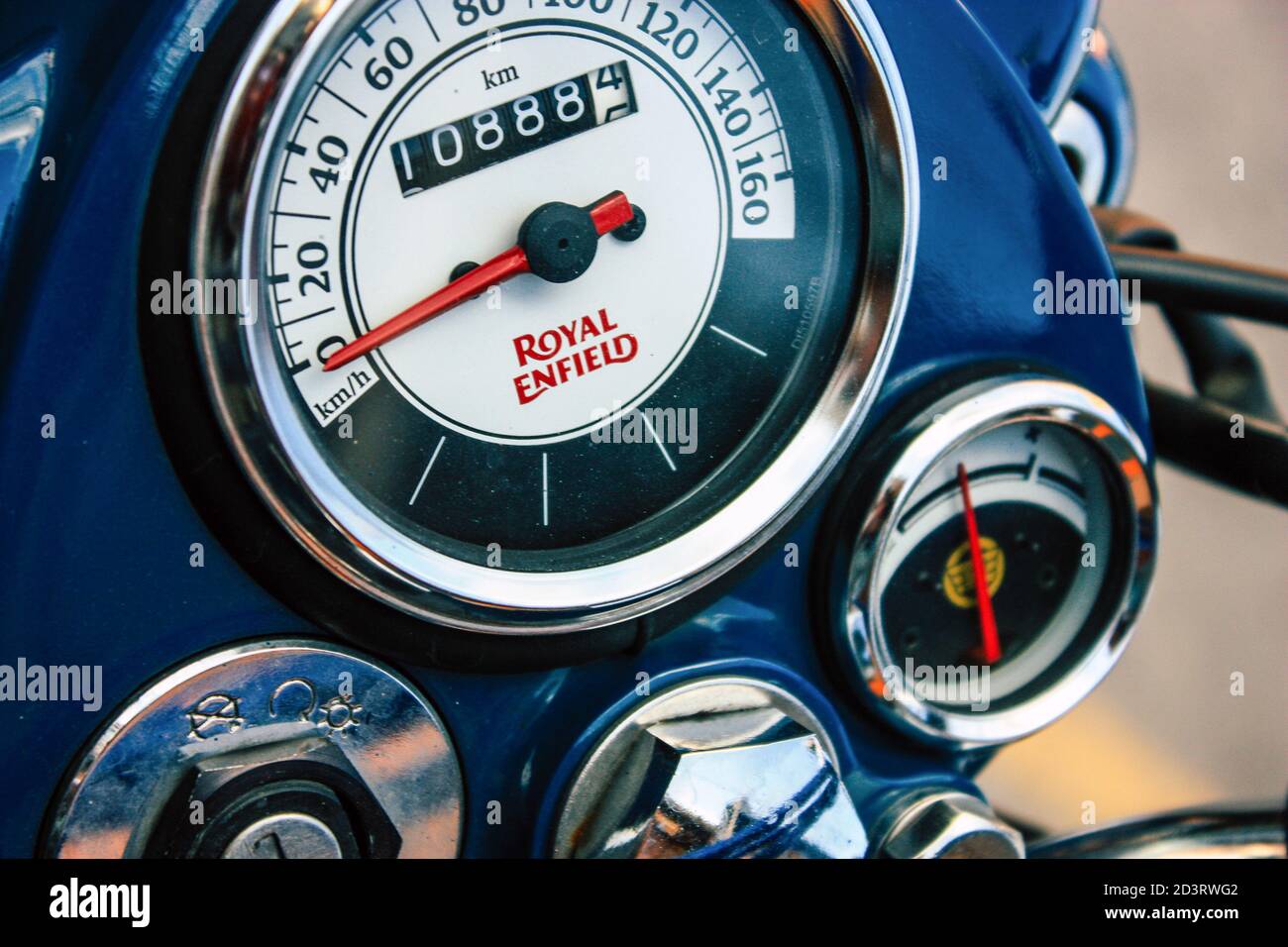 Closeup of a motorcycle rolling in the streets of the city center of ...