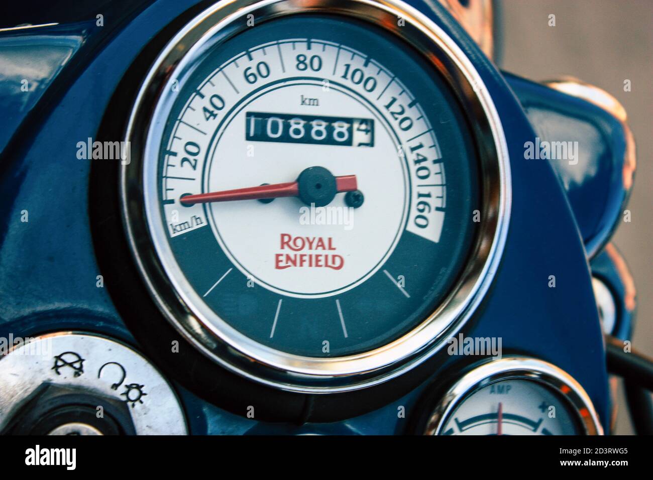 Closeup of a motorcycle rolling in the streets of the city center of ...