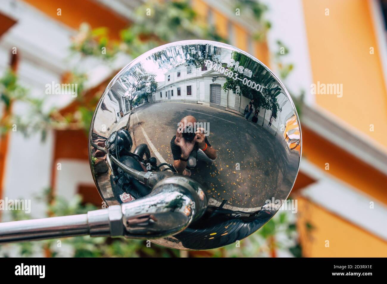 Closeup of a motorcycle rolling in the streets of the city center of ...
